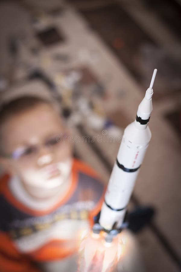 Kid Playing with Imaginary Real Rocket Stock Photo - Image of carpet ...