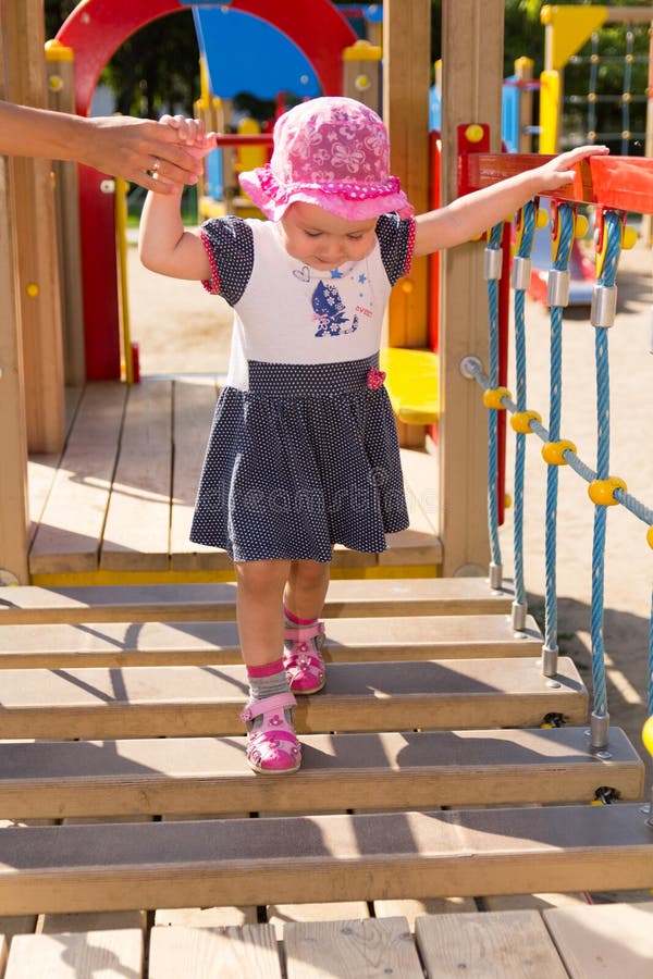 The Kid is Playing on the Playground Stock Image - Image of dress ...