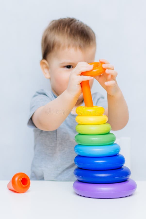 The Kid is Playing with the Pyramid in the Room Stock Photo - Image of ...