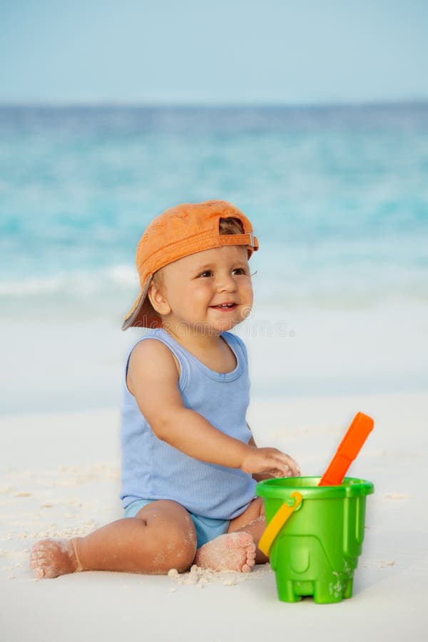Kid Playing with Sand on the Beach Stock Image - Image of lagoon ...