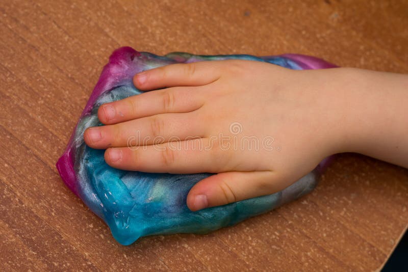 Kid Playing with Slime on Wooden Table Stock Photo - Image of child ...