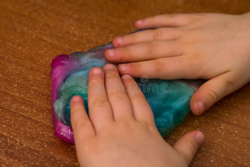 Kid Playing with Slime on Wooden Table Stock Image - Image of carantine ...