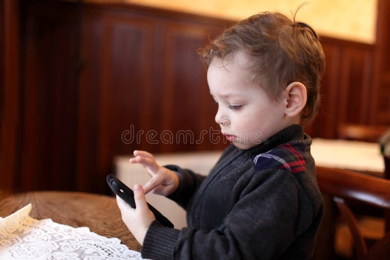 Kid Playing on the Smartphone Stock Photo - Image of innocence, playing ...