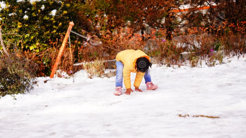 A Kid Playing with Snow in Snowfall Image Editorial Photo - Image of ...