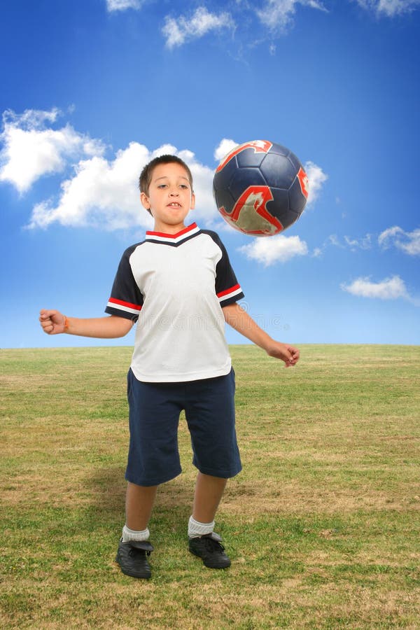 Kid playing soccer outside stock image. Image of game, field - 822579