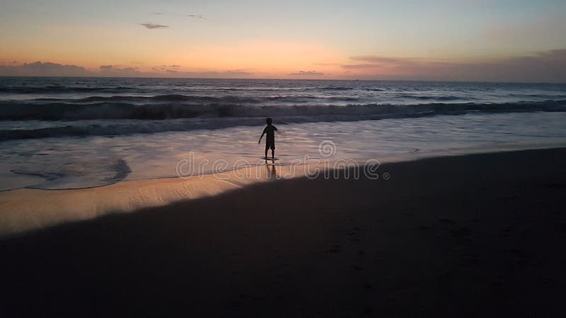 A Kid Playing Water with Sunset View Background Stock Photo - Image of ...