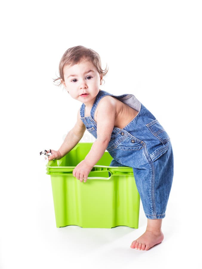 Kid plays with container stock photo. Image of isolated - 89919456