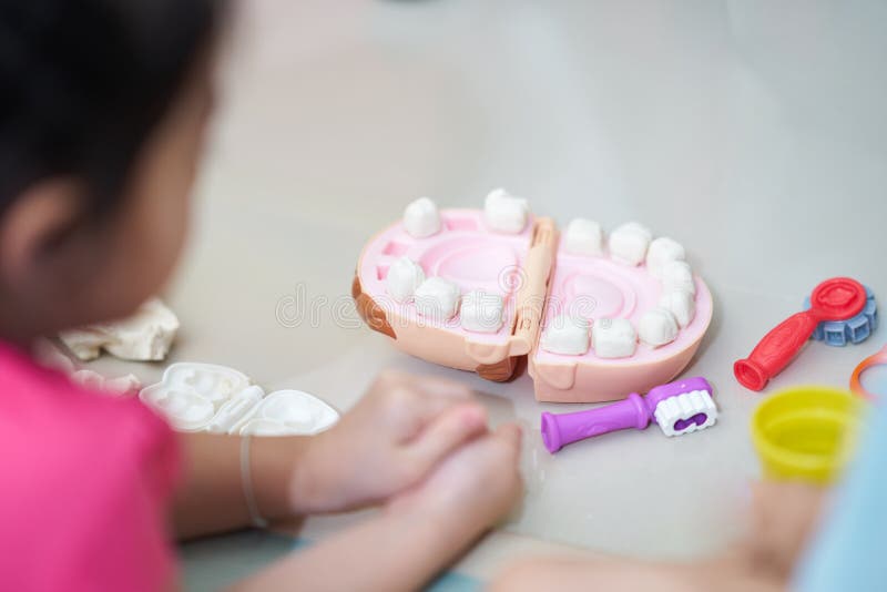 Kid Plays on Doh Clay in Dentist ,teeth and Tools on Floor Stock Photo ...