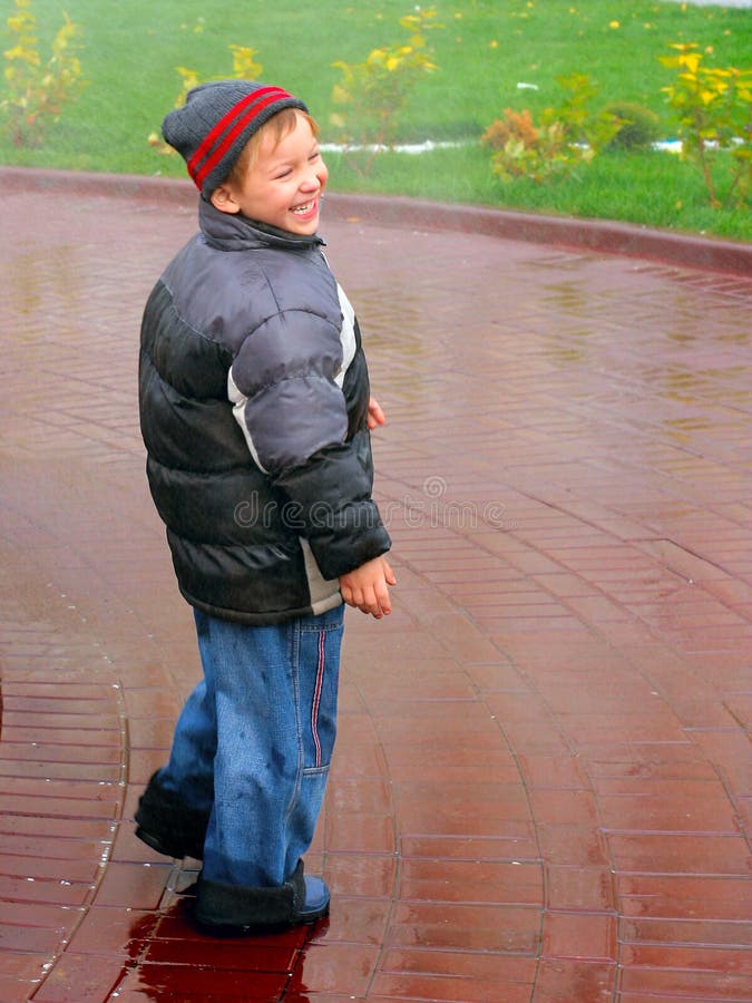 Kid in the rain stock photo. Image of laughing, funny - 7412246