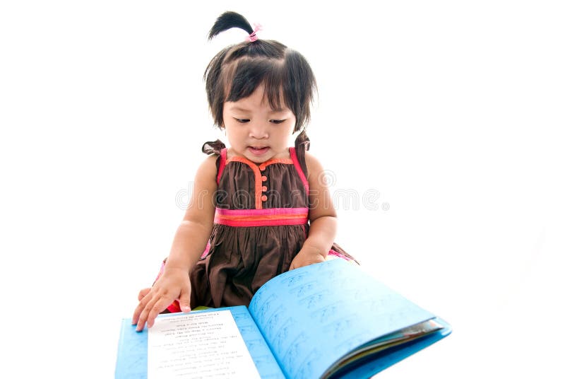 The kid reading a big book stock photo. Image of sweet - 17244236