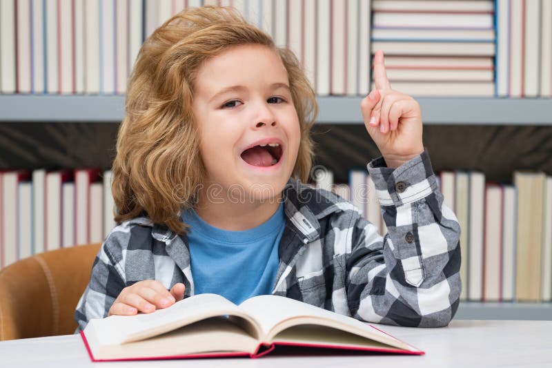 Kid Reading Book in a Book Store or Library, Stock Photo - Image of ...