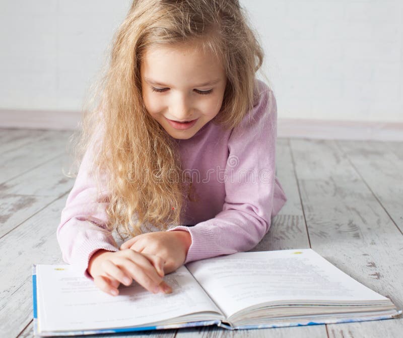 Kid reading book at home stock image. Image of indoors - 49917715