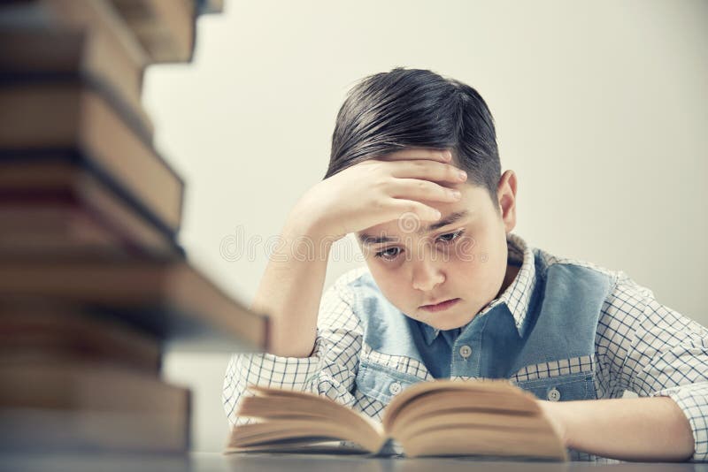 Kid reading books stock image. Image of stress, unhappy - 171325945