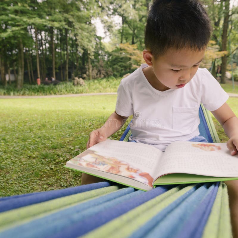 Kid reading stock photo. Image of chinese, story, leisure - 73547110