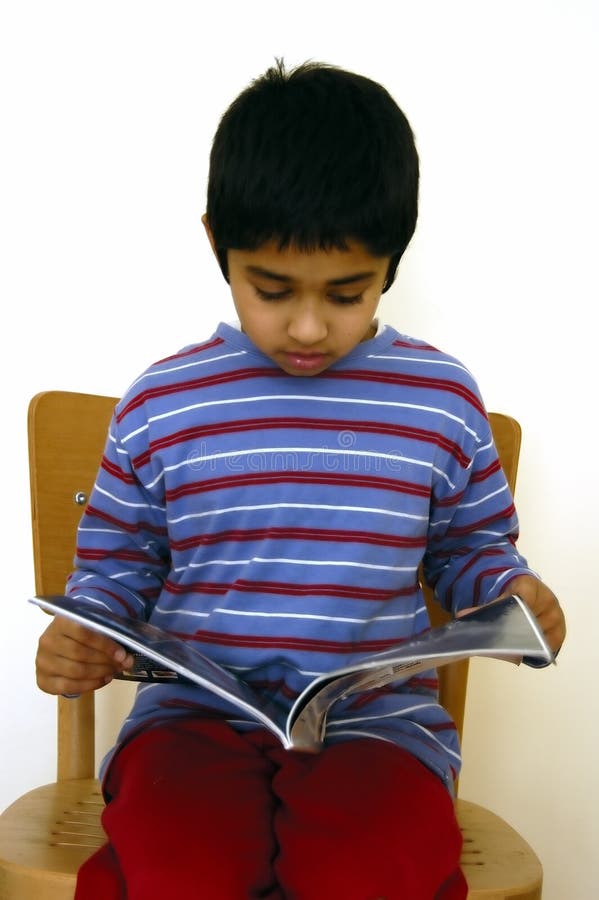 Kid reading a magazine stock image. Image of livingroom - 1953537