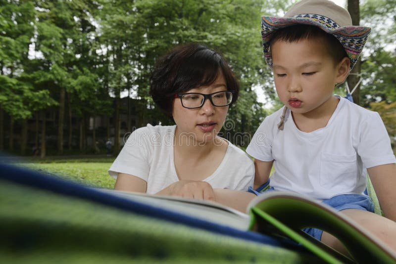 Kid Reading with Mom Together Stock Photo - Image of asian, relax: 73547882