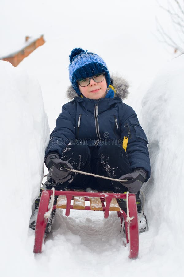 Kid ride on sled stock photo. Image of slide, sledding - 214163978