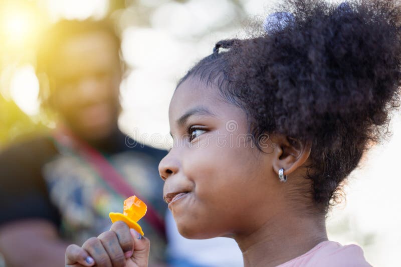 Kid with Ring Pop Candy in Park, Girl Enjoy with Ring Candy Pops Stock ...