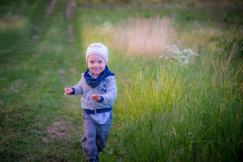 Kid running in nature stock image. Image of green, caucasian - 171859517