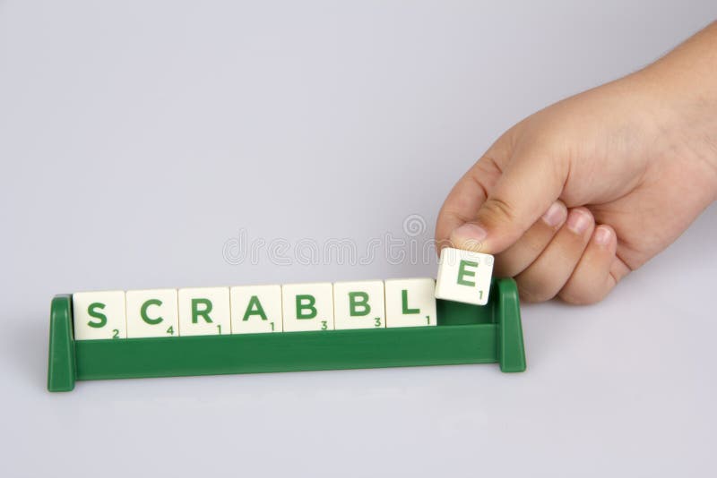 Kid S Hand Putting Scrabble E Letter Tile Editorial Stock Photo - Image ...