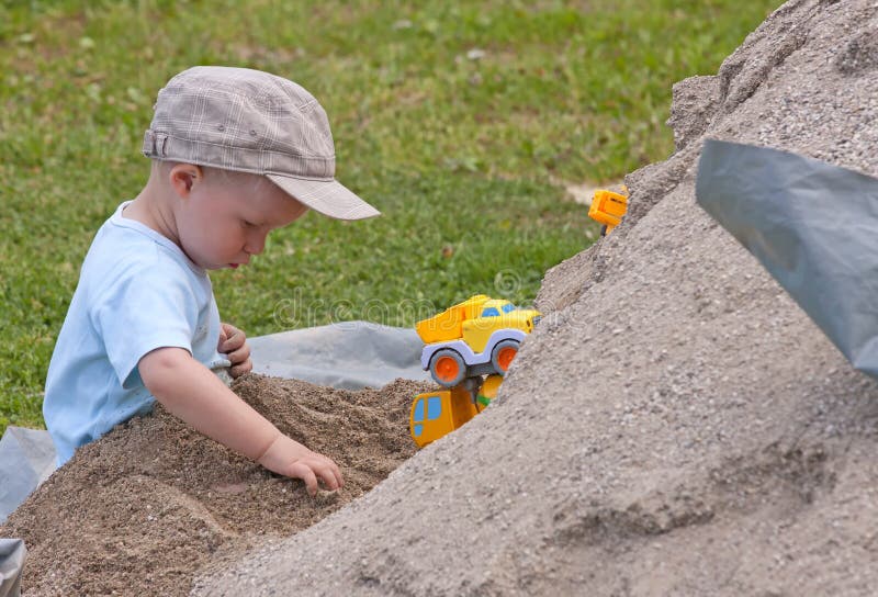 Kid in sand stock photo. Image of toddler, build, little - 25664366