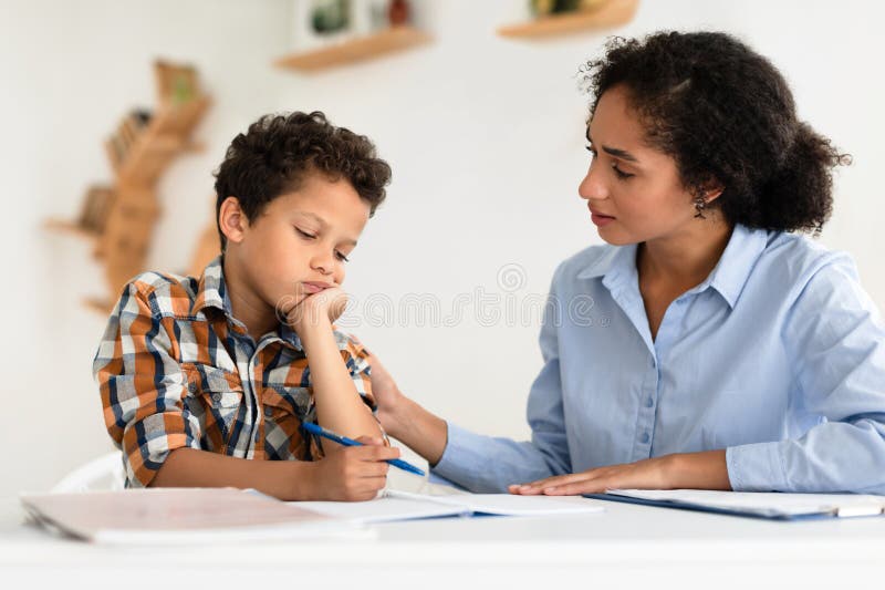 Mom Comforting Unhappy Schoolboy Son Having Issue with Homework Indoors ...