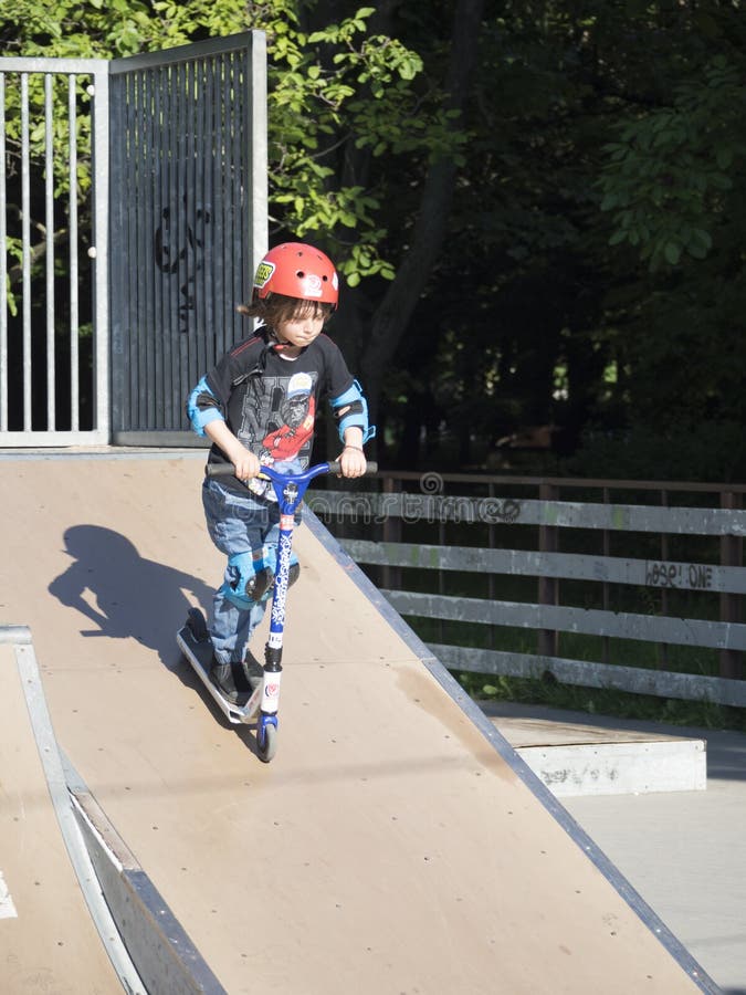 Kid with a scooter editorial stock photo. Image of enjoying - 93009913