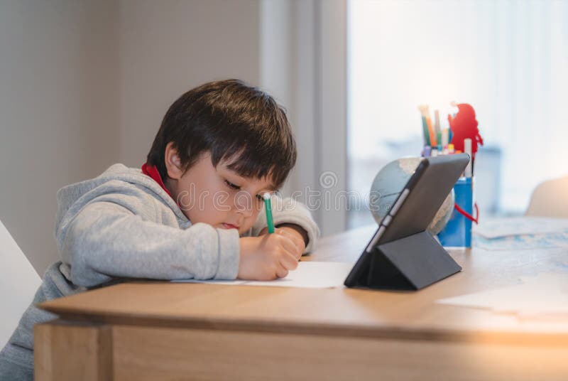 Kid Self Isolation Using Tablet for His Homework,Child Boy Using ...
