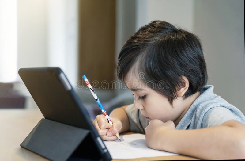 Kid Self Isolation Using Tablet for His Homework,Child Doing Using ...