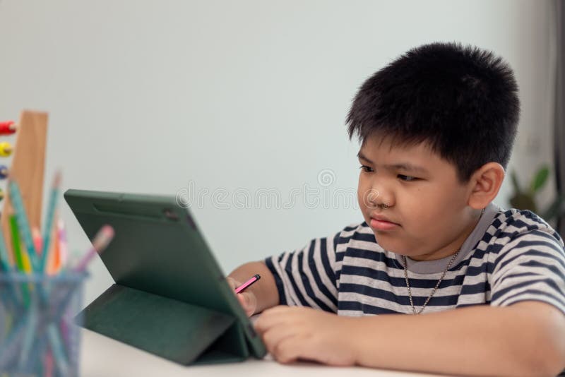 Kid Self Isolation Using Tablet for His Homework,Child Doing Using ...