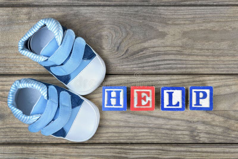 Kid shoes and word help stock photo. Image of childhood - 75086160