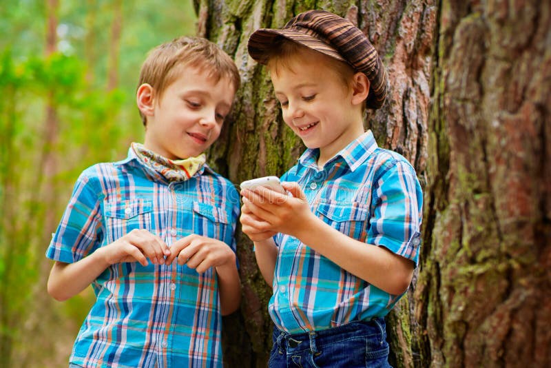The Kid is Showing His Brother Various Games on Stock Image - Image of ...