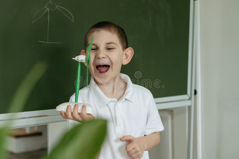 Kid Shows and Explains about Wind Generator Model at School Stock Image ...