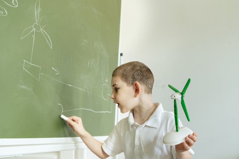 Kid Shows and Explains about Wind Generator Model at School Stock Photo ...