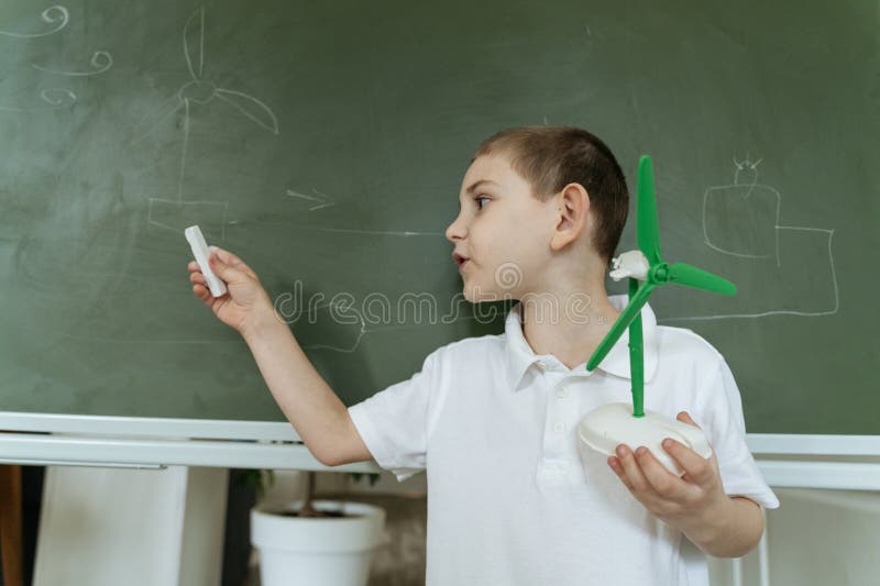 Kid Shows and Explains about Wind Generator Model at School Stock Photo ...