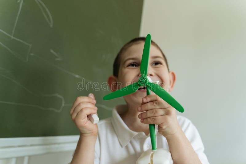 Kid Shows and Explains about Wind Generator Model at School Stock Photo ...