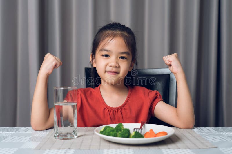 Kid Shows Strength of Eats Vegetables and Nutritious Food Stock Photo ...