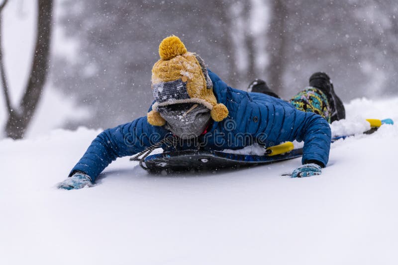 Kid on a Sledge stock image. Image of holiday, sport - 189142209
