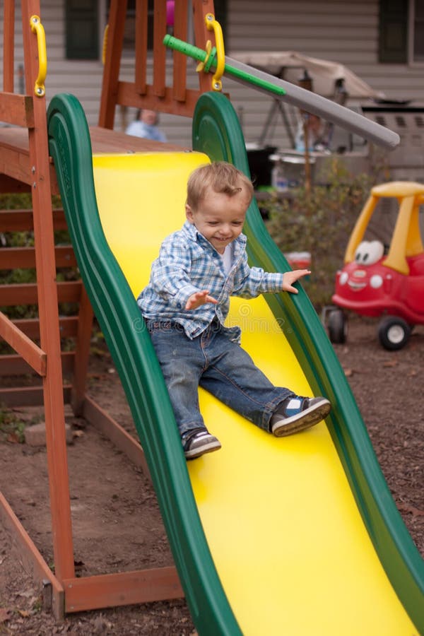 Kid on slide stock photo. Image of playground, sneakers - 39117538