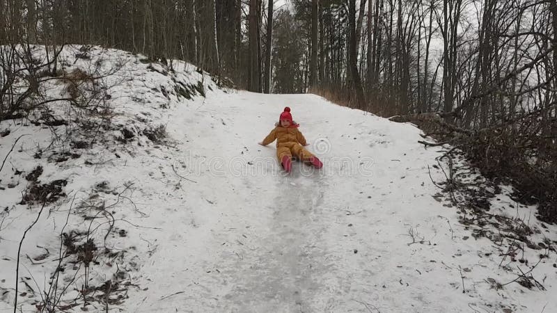 Kid Slides Down on Snow Mountain Hil Stock Video - Video of family ...
