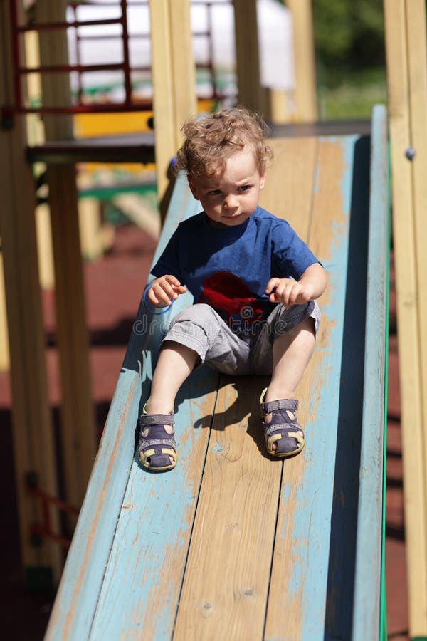 Kid sliding on a slide stock image. Image of park, person - 32261501