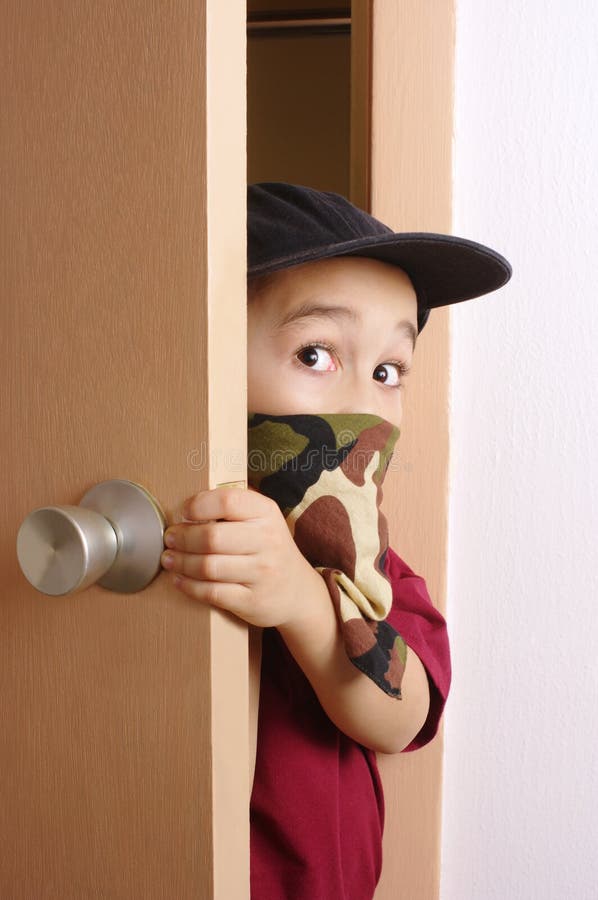 Kid sneaking through door stock image. Image of secret - 16041909