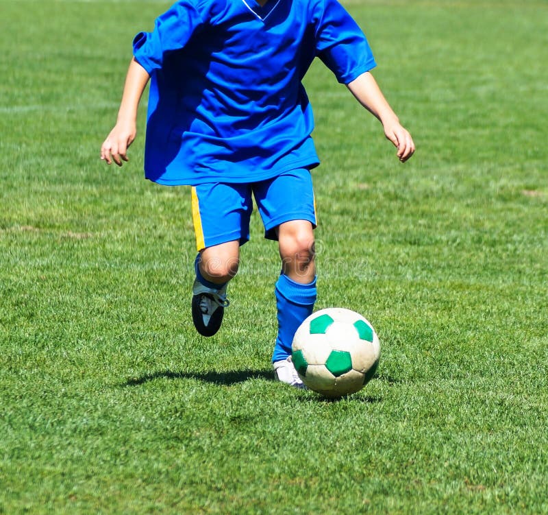 Kid soccer player stock photo. Image of child, green - 61792138