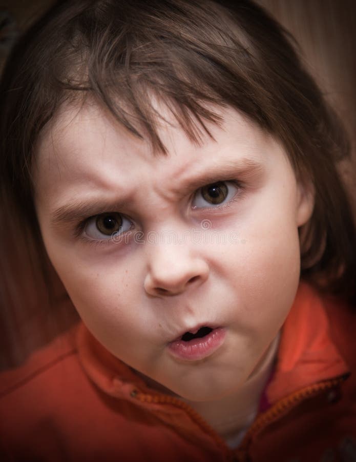 Kid with a sour face. stock photo. Image of childhood - 72409288