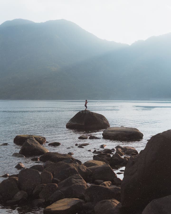 Kid Standing on Rock Surrounded by Water Stock Image - Image of posing ...