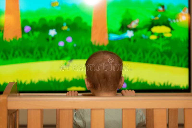 The Kid Stared at the Big TV Screen. Concept of Knowledge of the World ...