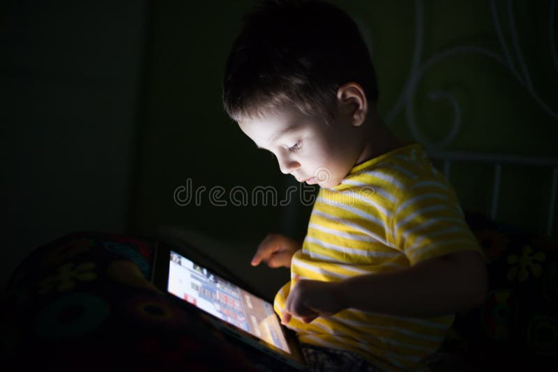Kid with Tablet in the Dark Stock Photo - Image of cage, living: 50229158