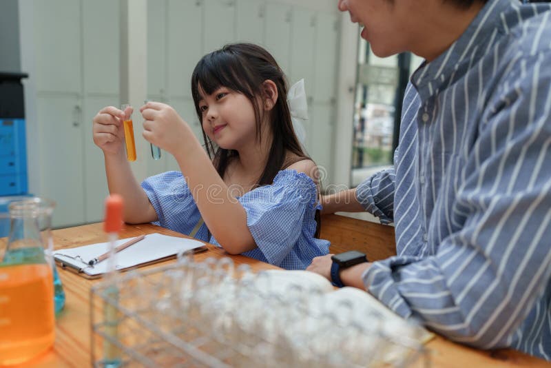 Kid and Teacher Doing Science Experiments. Back To School Concept Stock ...