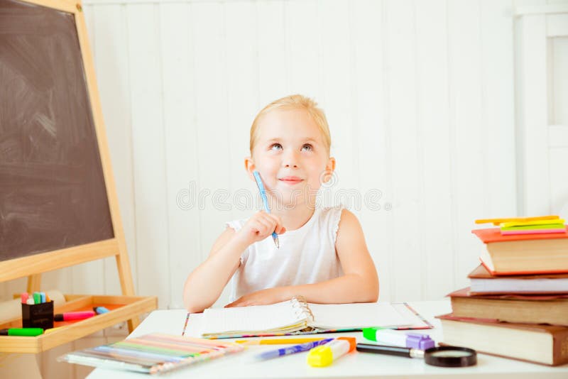 Kid Thinking Wile Doing Her Homework. Stock Image - Image of elementary ...