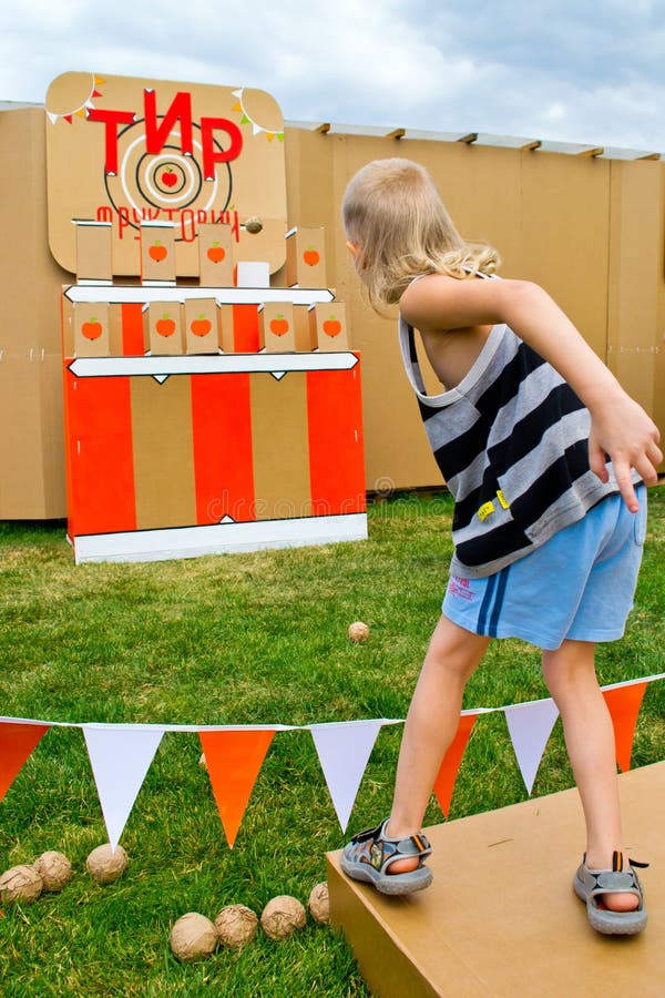 Kid Throwing Balls at a Target Stock Image - Image of color, baby: 43681225